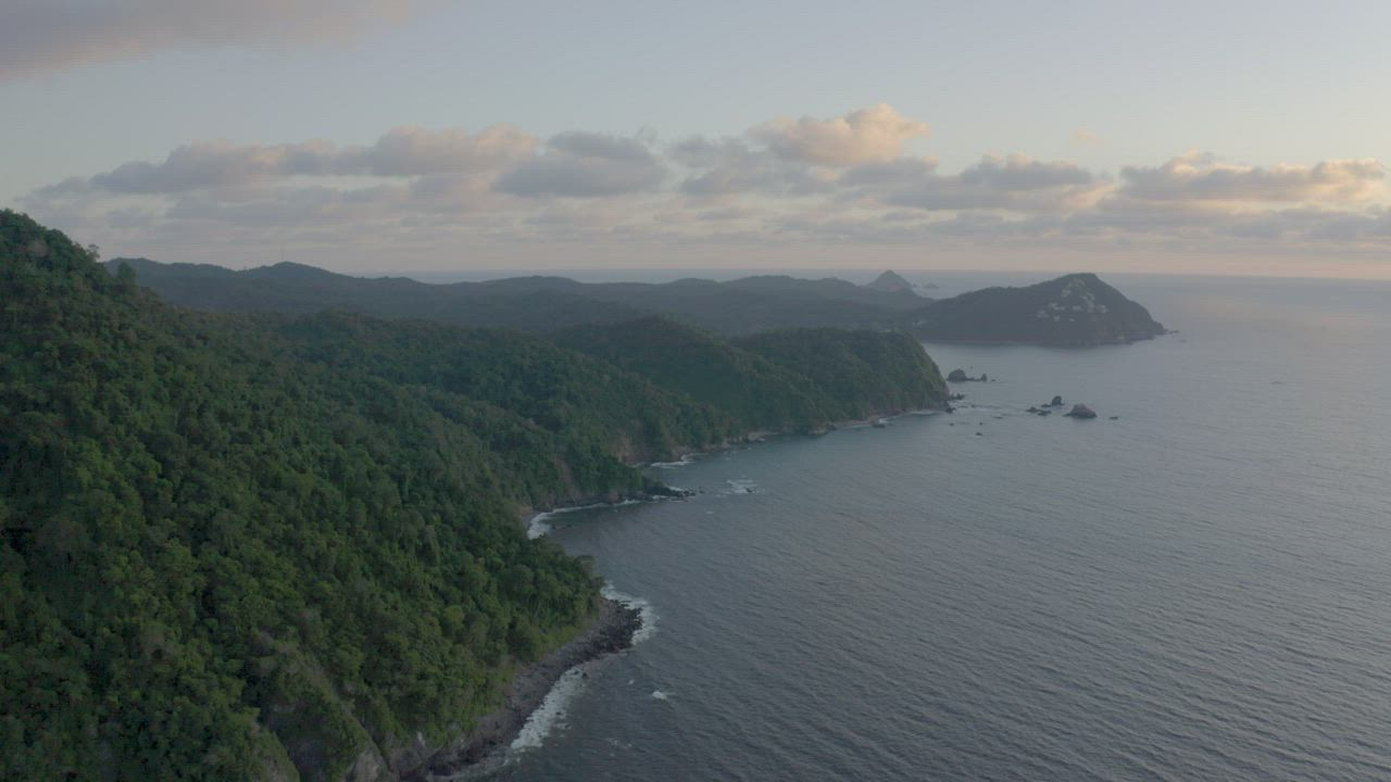 Aerial shot of a peninsula and the sea - Free Stock Video