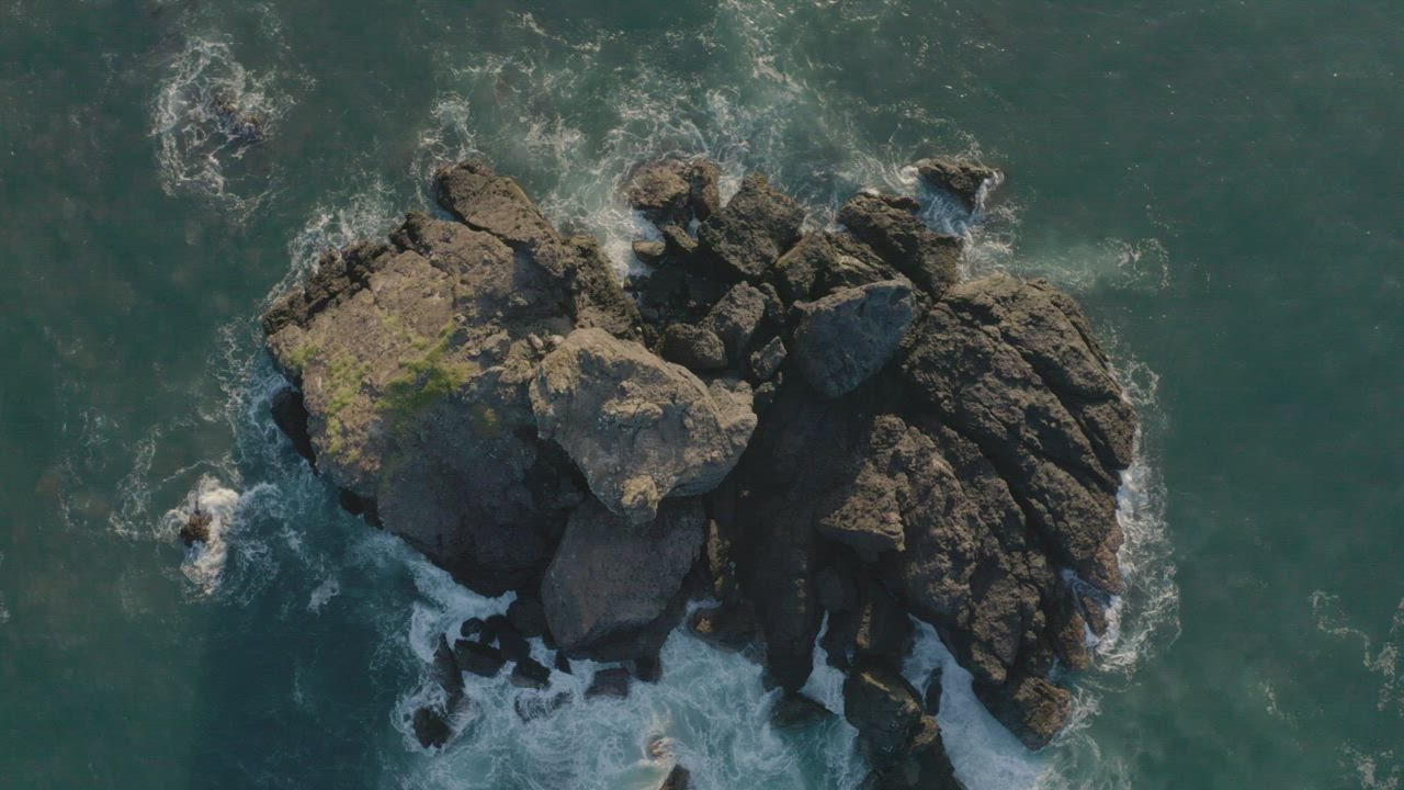 Rock formations in the sea in a view from above - Free Stock Video