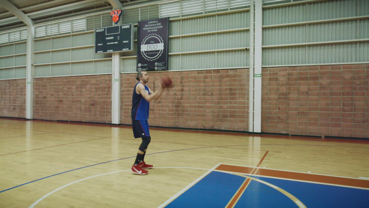 Pair of basketball players practicing shots - Free Stock Video
