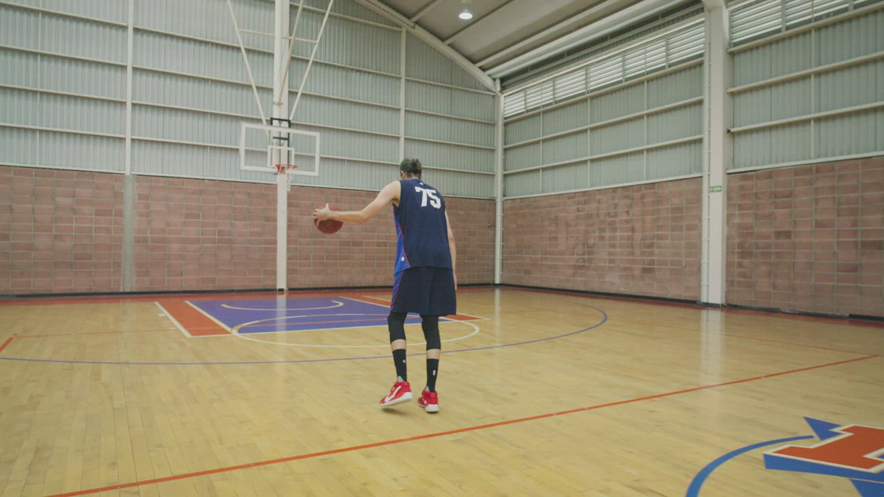 Basketball player dunking training a court alone - Free Stock Video