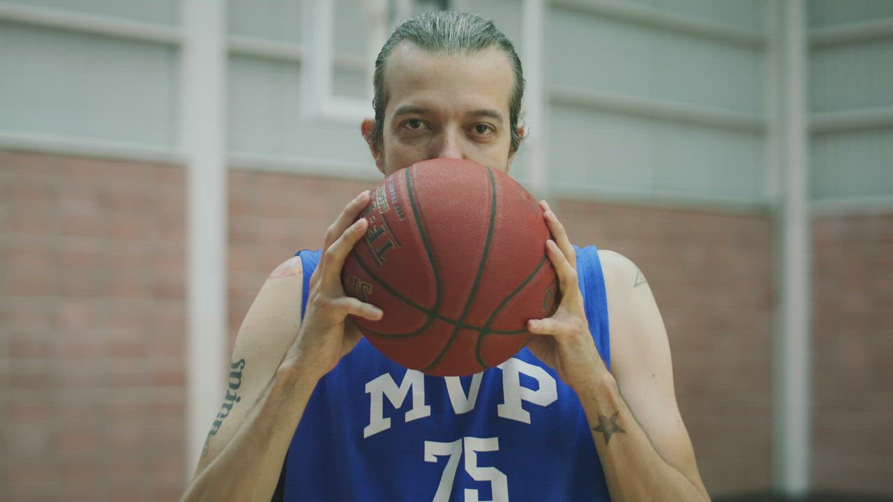 Front portrait of a basketball player with the ball - Free Stock Video