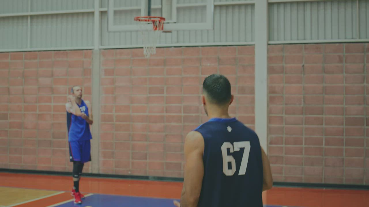 Pair of basketball players training shots - Free Stock Video