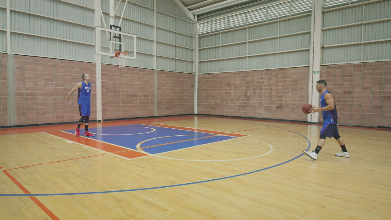 Two basketball players training on a court - Free Stock Video