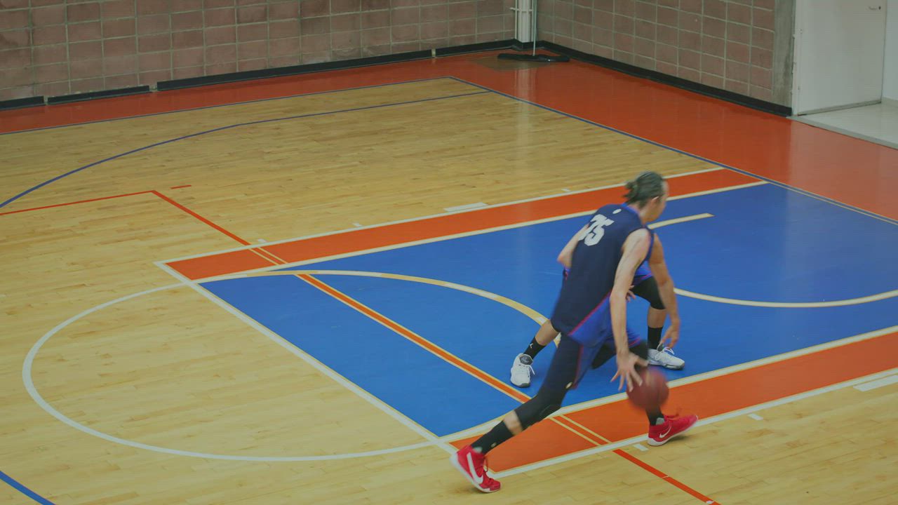 Two basketball players playing one on one - Free Stock Video