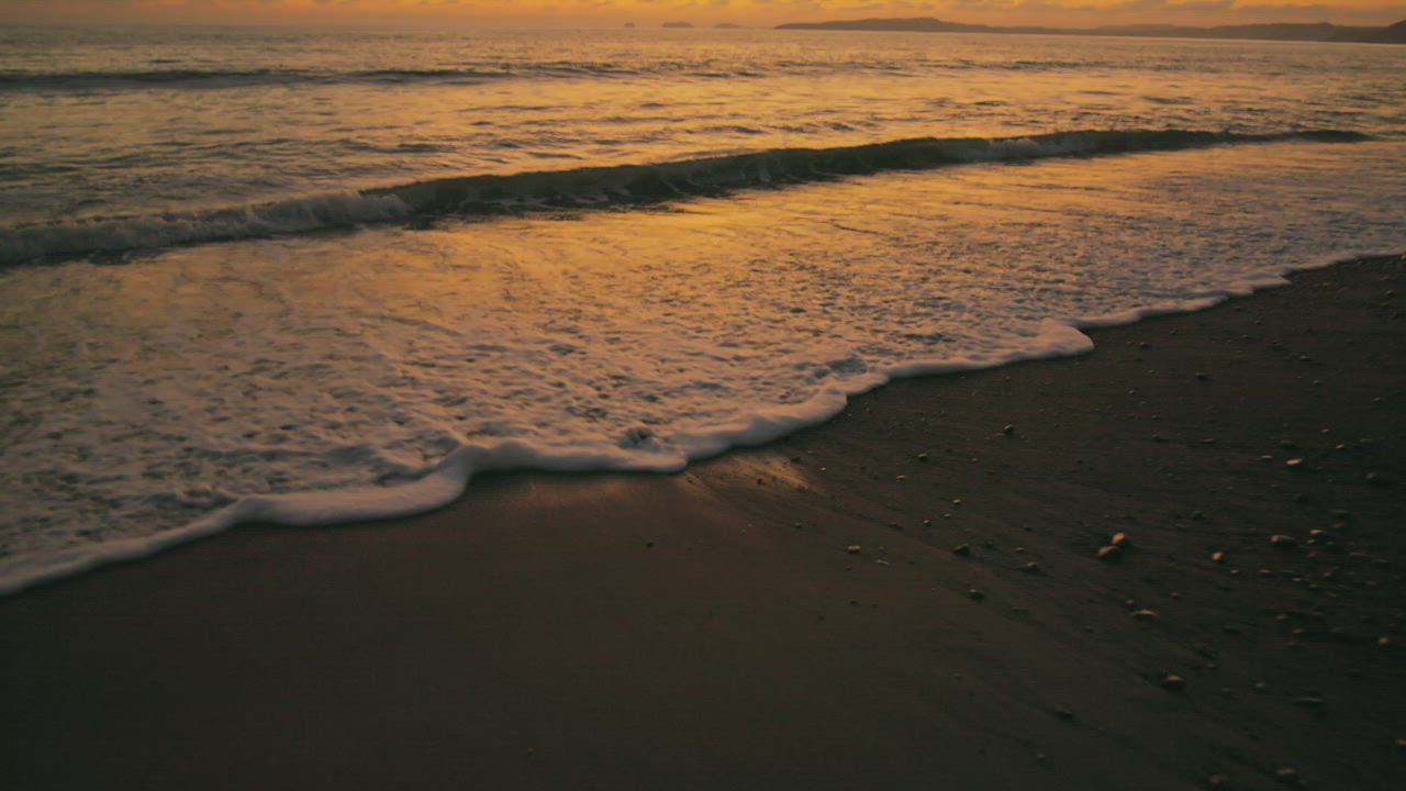 Sunset from a peaceful beach - Free Stock Video
