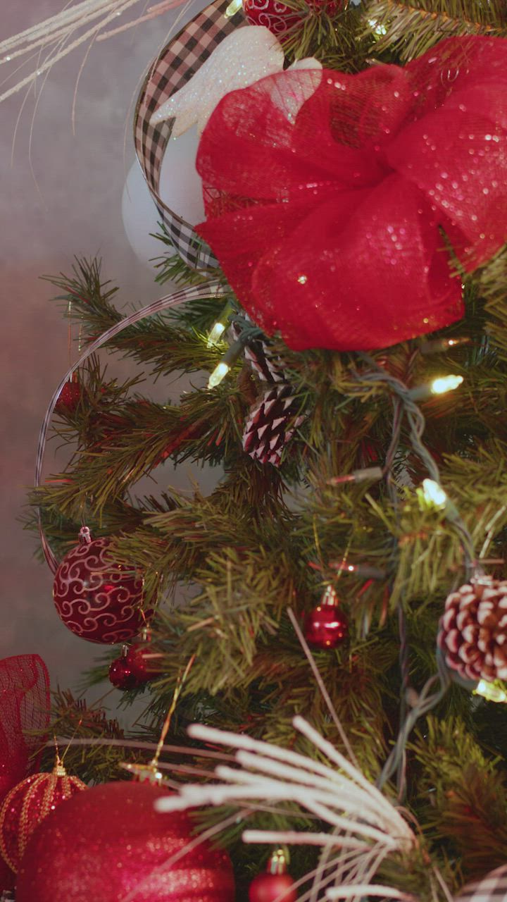 Putting a sphere on a Christmas tree - Free Stock Video