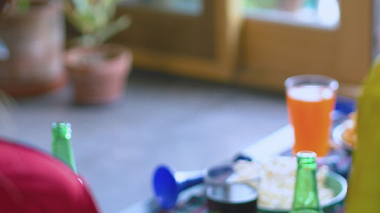 Turning up the volume on the TV during a meeting - Free Stock Video