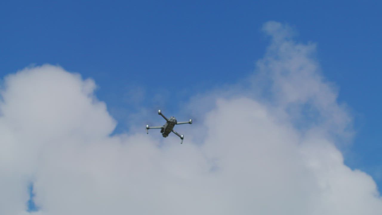 Small drone soaring high in the sky - Free Stock Video