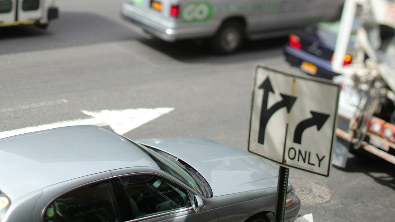 Close-up shot of highway traffic near a sign - Free Stock Video
