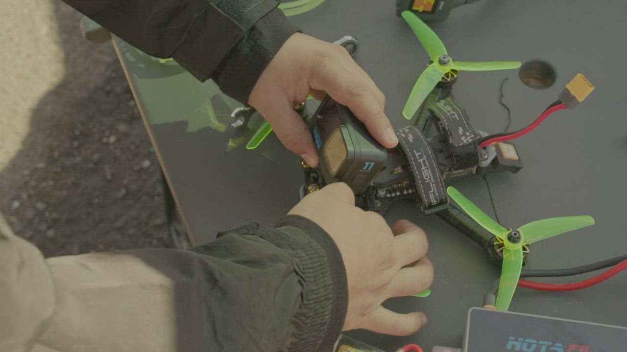 Mounting a sports camera on a drone - Free Stock Video