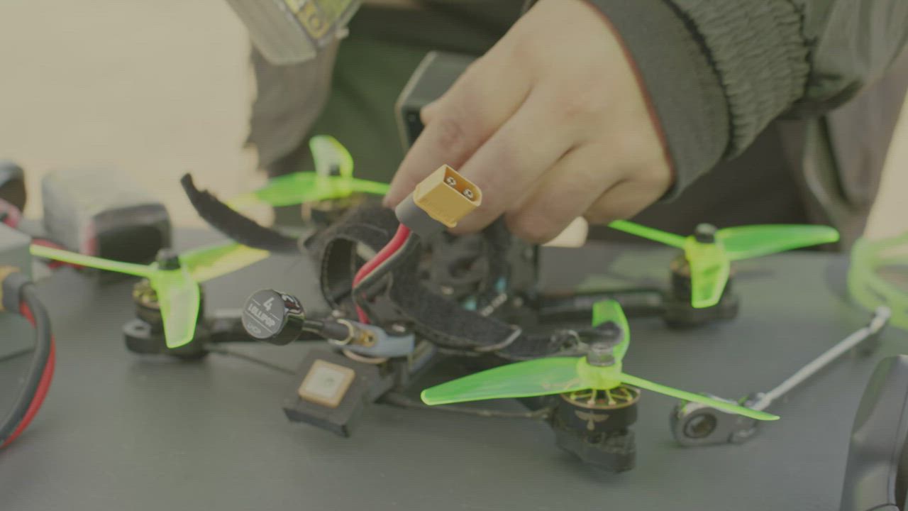 Man assembling a sophisticated homemade drone - Free Stock Video