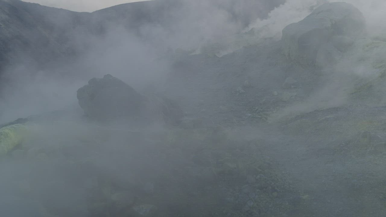 Volcano releasing smoke from the ground - Free Stock Video