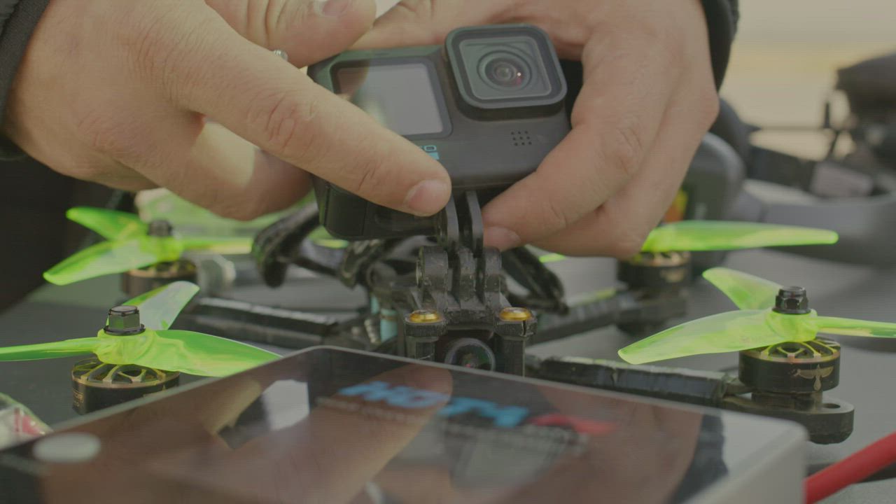 Man assembling a camera to a drone - Free Stock Video
