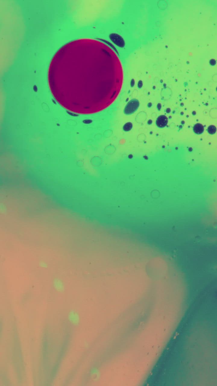 Abstract flow of a drop of pink ink in a thick liquid - Free Stock Video