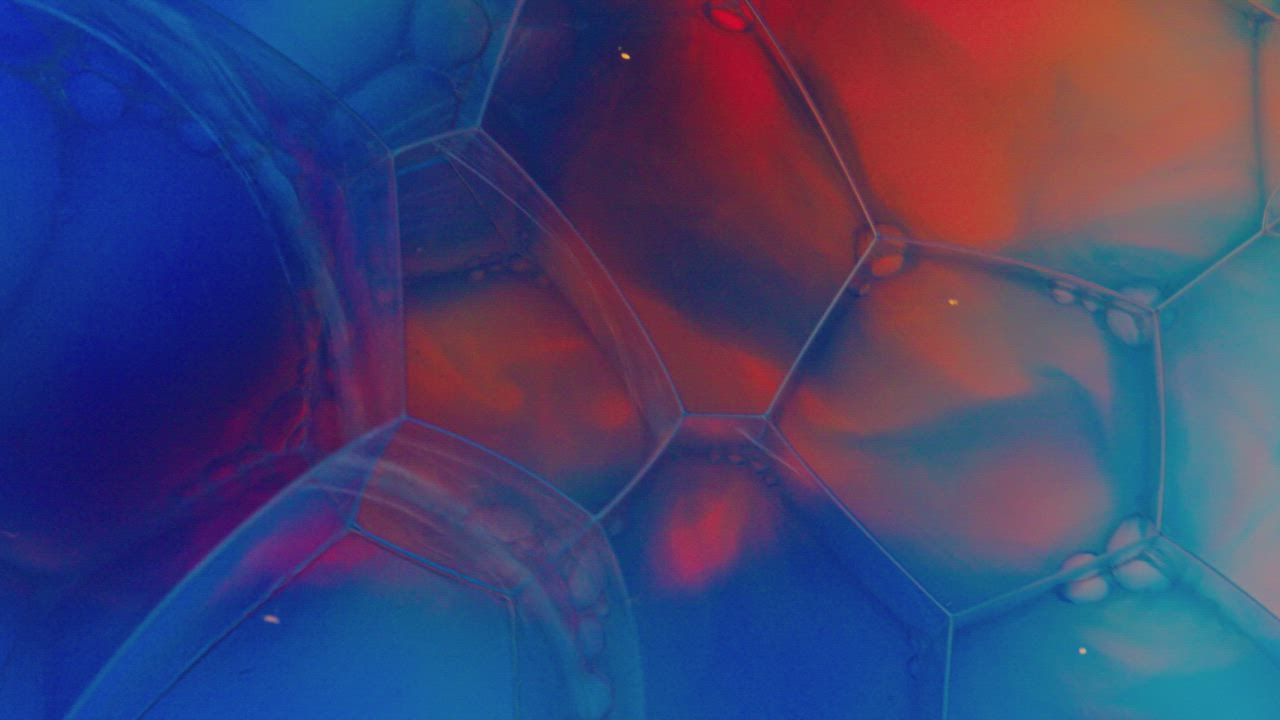 Abstract texture of a bubbling liquid with colored inks - Free Stock Video