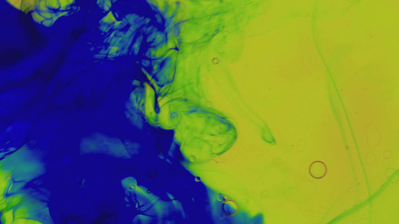 Blue ink texture flowing on yellow background - Free Stock Video