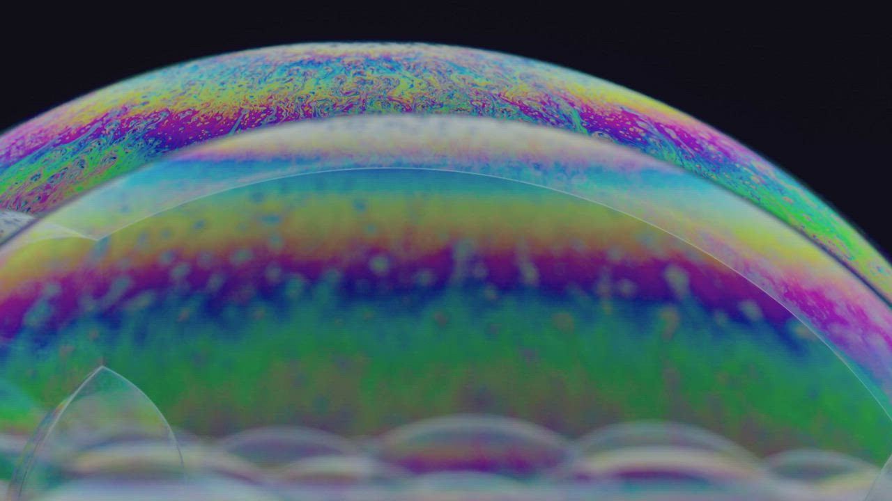 Strange shapes in soap bubbles with iridescent effect - Free Stock Video