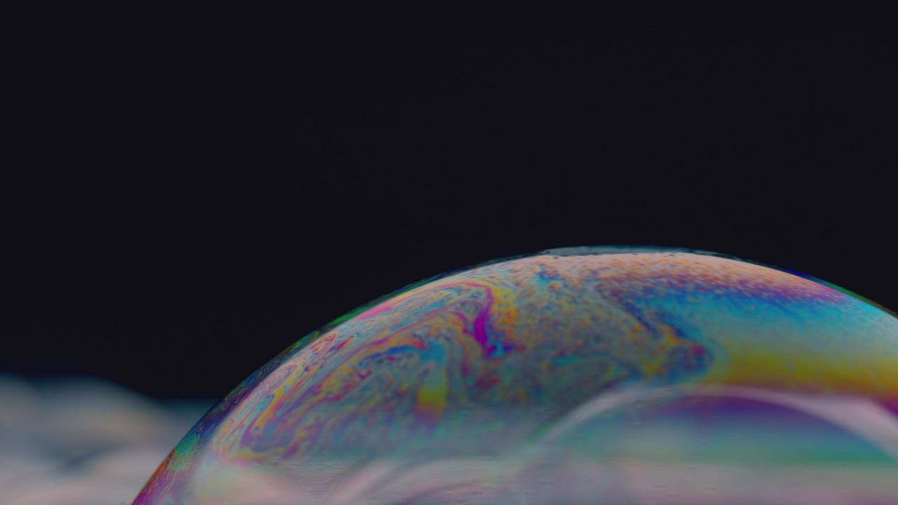 Soap bubble surfaces with iridescent effect - Free Stock Video