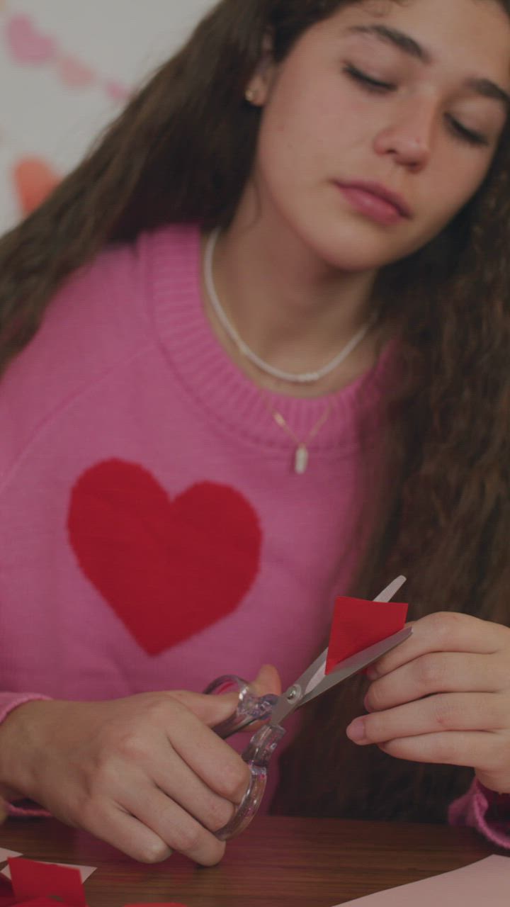 Portrait of a girl making a valentine card - Free Stock Video