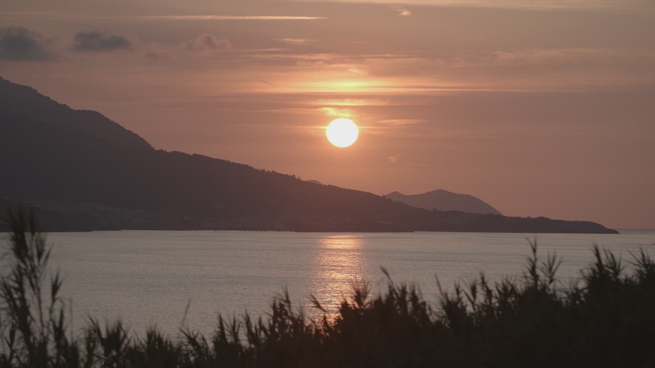 Red sunset sun on a coast - Free Stock Video