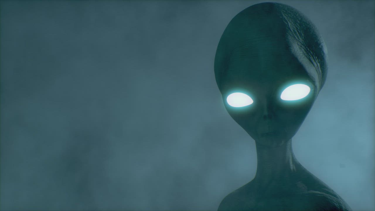 Scary alien with glowing eyes blinking slowly in a smoky haze - Free ...