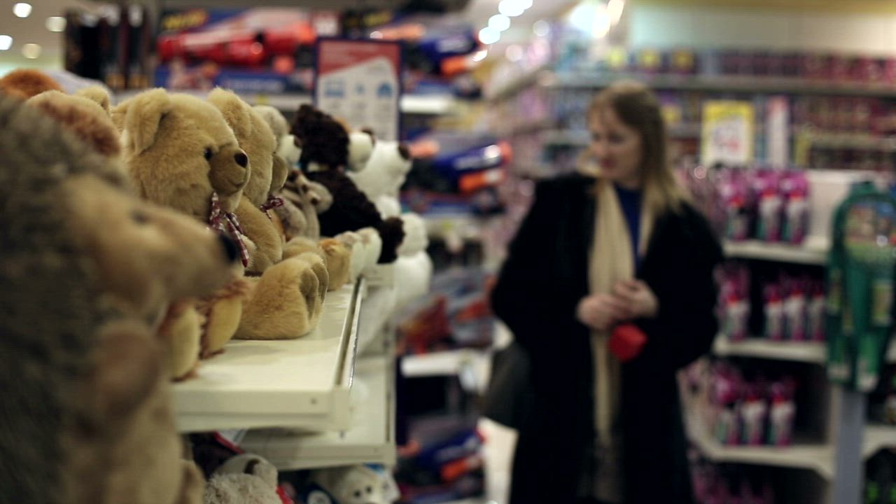 Shopping for a teddy bear in a retail store - Free Stock Video