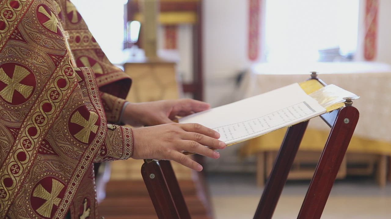 Hands of a priest at a lectern - Free Stock Video