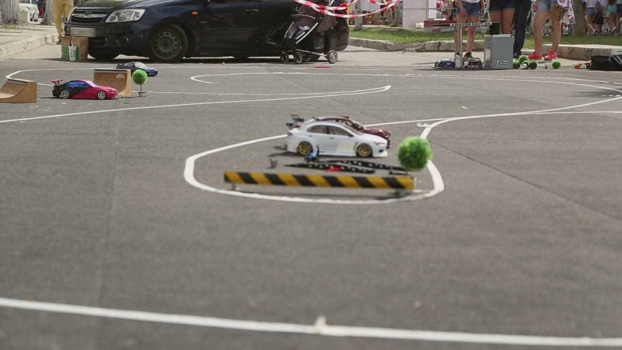 Toy car racing and drifting around a race track - Free Stock Video