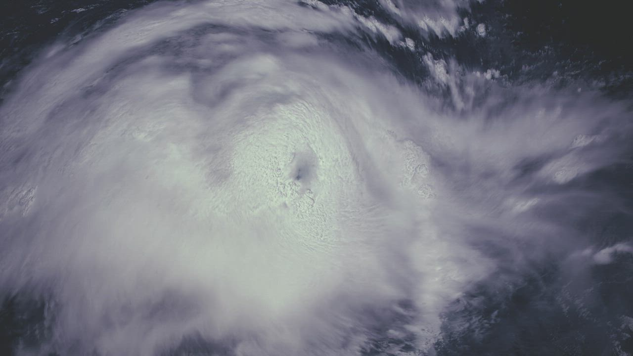 Swirling vortex of storm clouds as seen from space - Free Stock Video