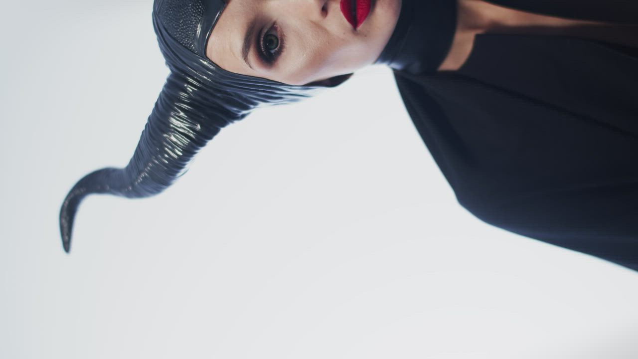Vertical video of a woman dressed in a horned witch costume - Free ...