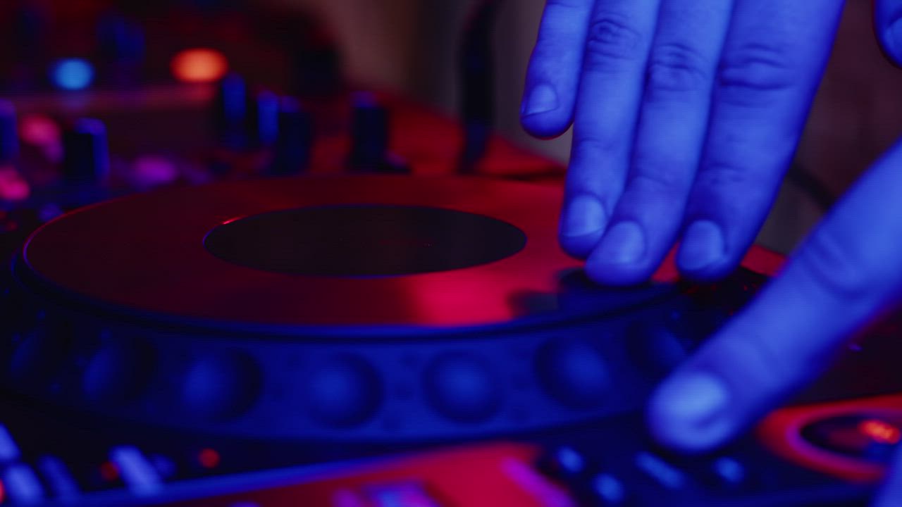 DJ hand mixing music at a nightclub - Free Stock Video