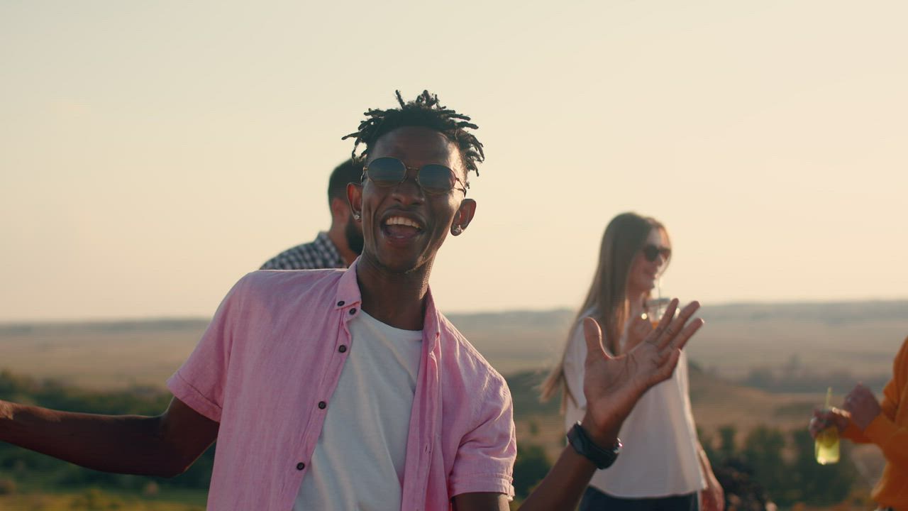 Man singing and dancing to music happily with a group of friends - Free ...