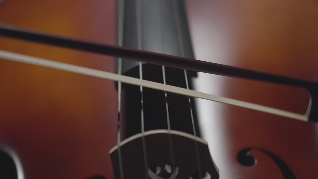 A close up shot of a musician playing a cello - Free Stock Video