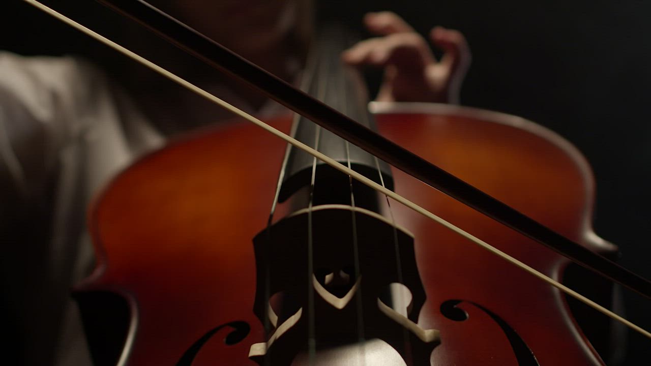 Close up of a classical musician playing a cello - Free Stock Video