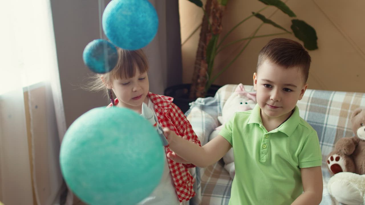 Children playing with a toy rocket with soft toys on a couch - Free ...