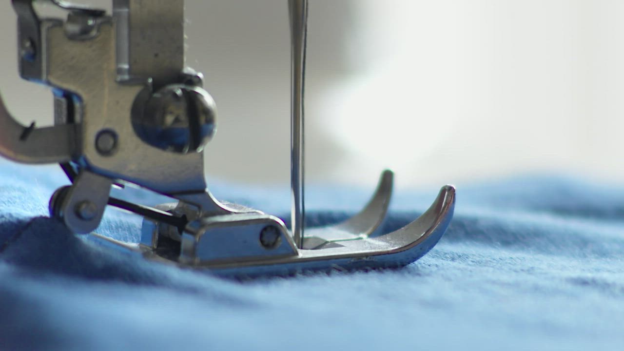 Slow motion of a sewing machine stiching an item of clothing - Free ...