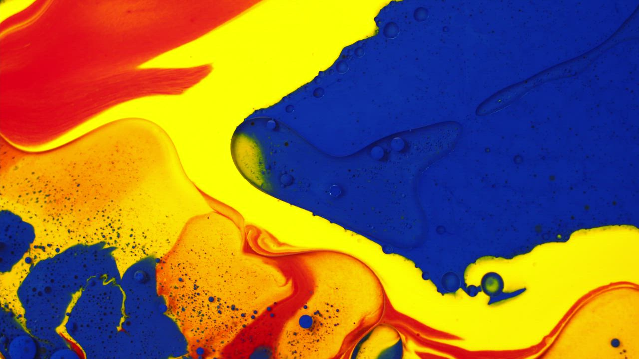 Slow motion of colourful ink blending together - Free Stock Video