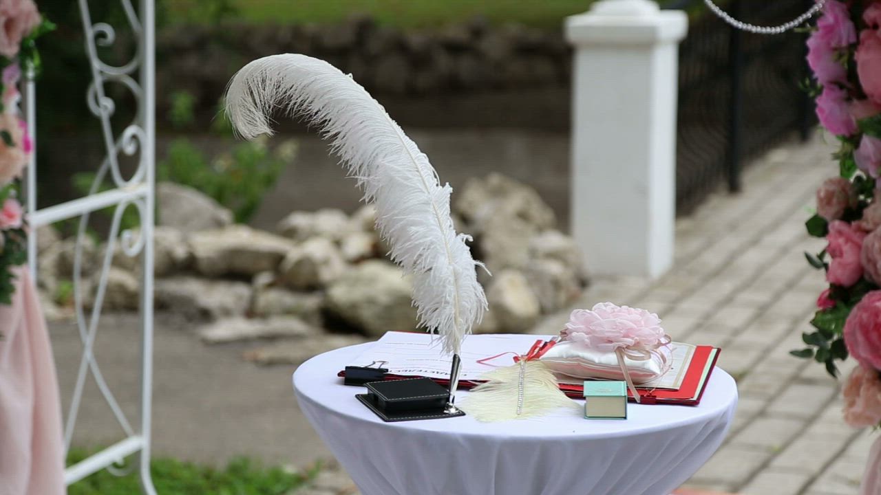 Wedding registry table with a feathered pen - Free Stock Video