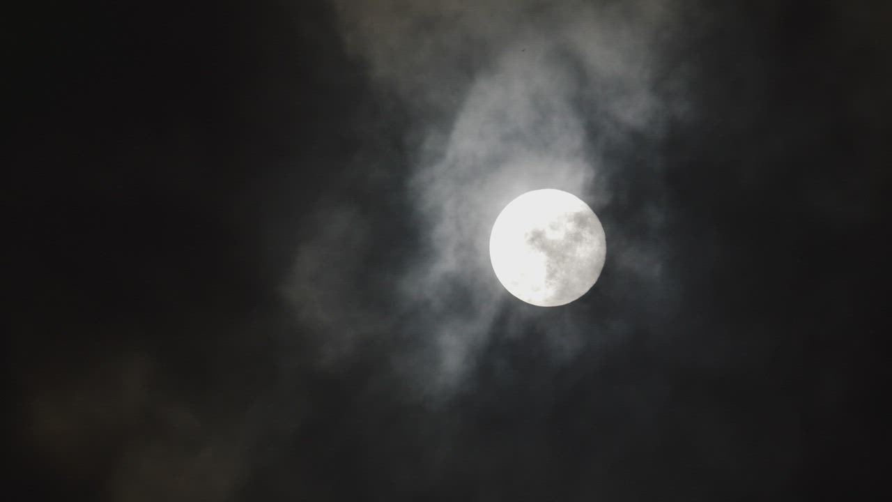 Bright full moon at midnight with clouds moving across the sky - Free ...
