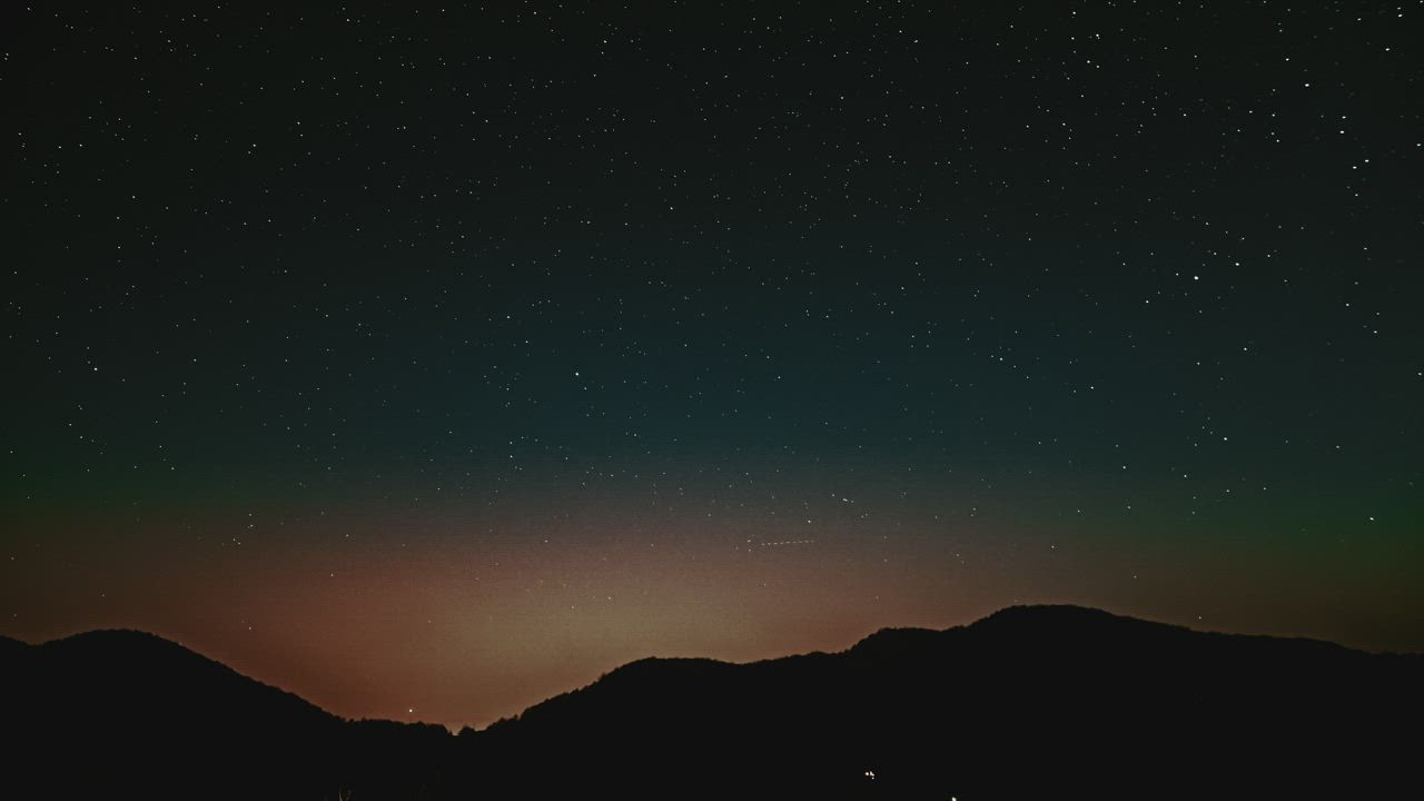 Shooting star over mountains and stars - Free Stock Video