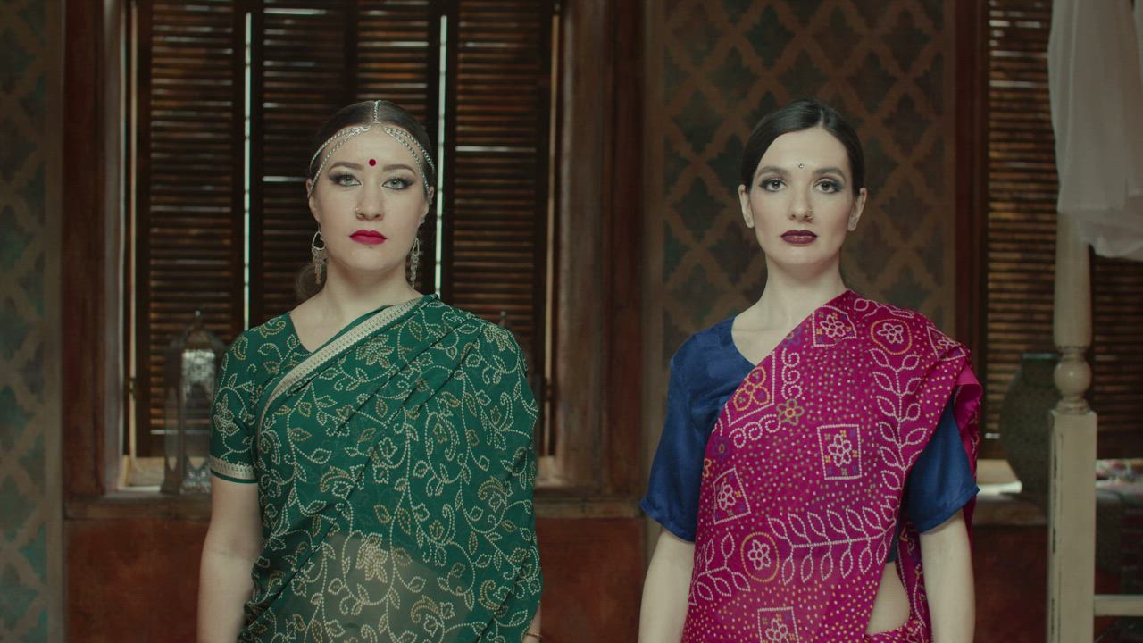 Women smile and nod with prayer pose - Free Stock Video