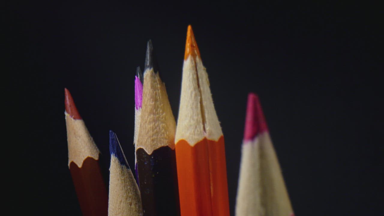 Colourful pencils on a black background - Free Stock Video