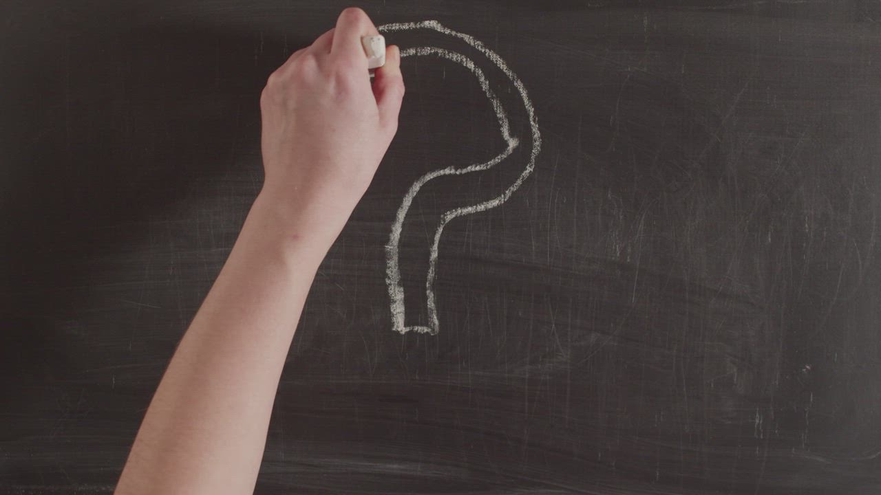 Person drawing a large question mark with chalk on a blackboard - Free ...