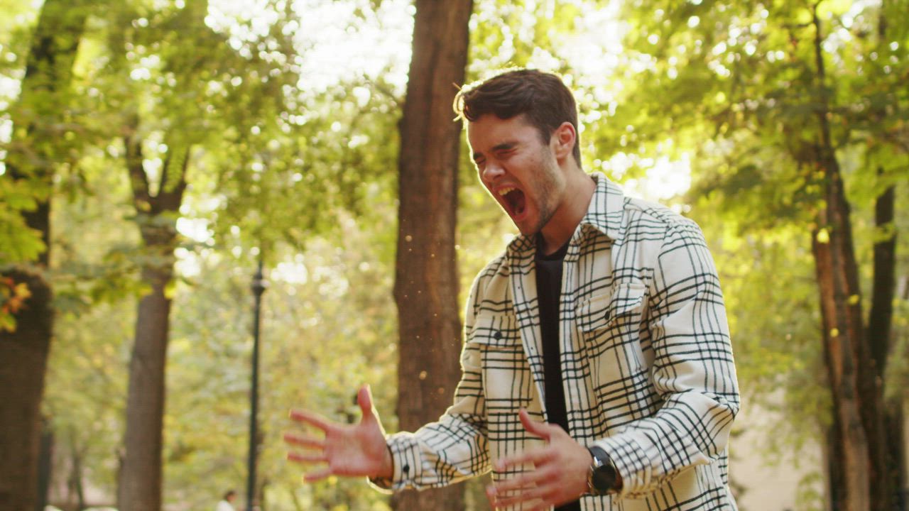 Man letting out his rage in an empty forest - Free Stock Video