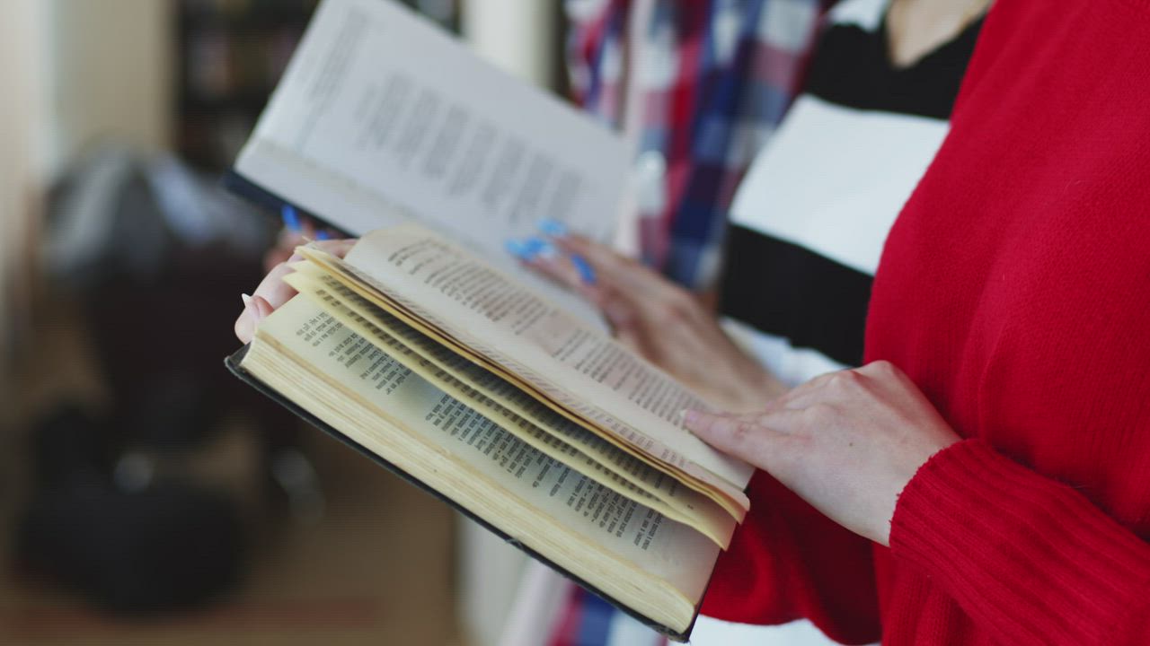 People enjoying silently flipping through books at a bookshop - Free ...