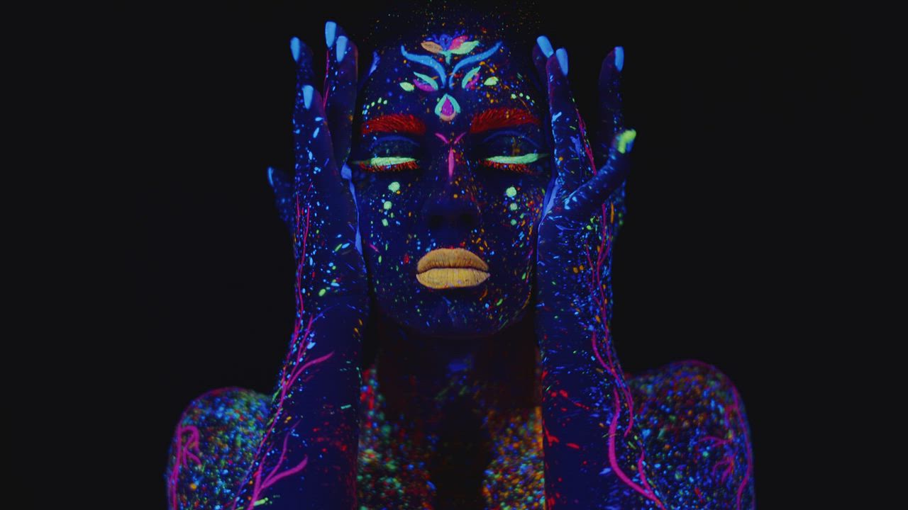 Beautifully painted model glowing under UV lights - Free Stock Video