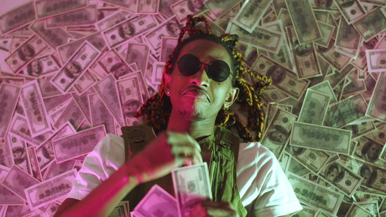Rapper lying in a pile of money throwing money in the air - Free Stock ...