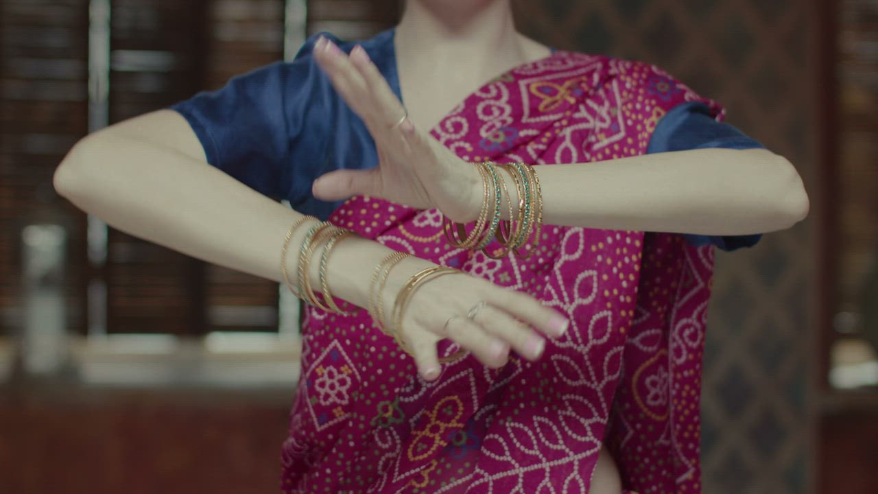 Woman dances doing movements with her hands - Free Stock Video