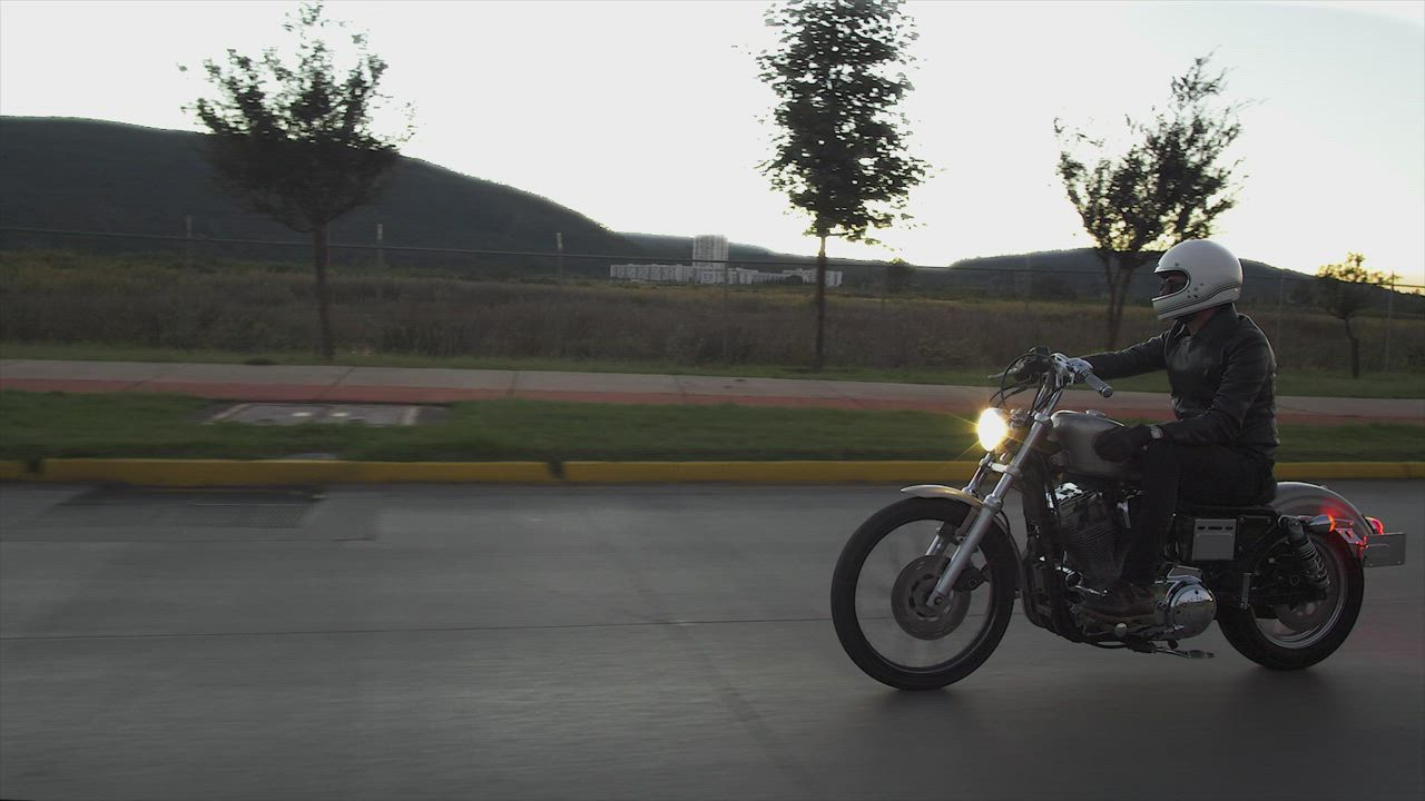 Person driving a motorcycle in the street - Free Stock Video