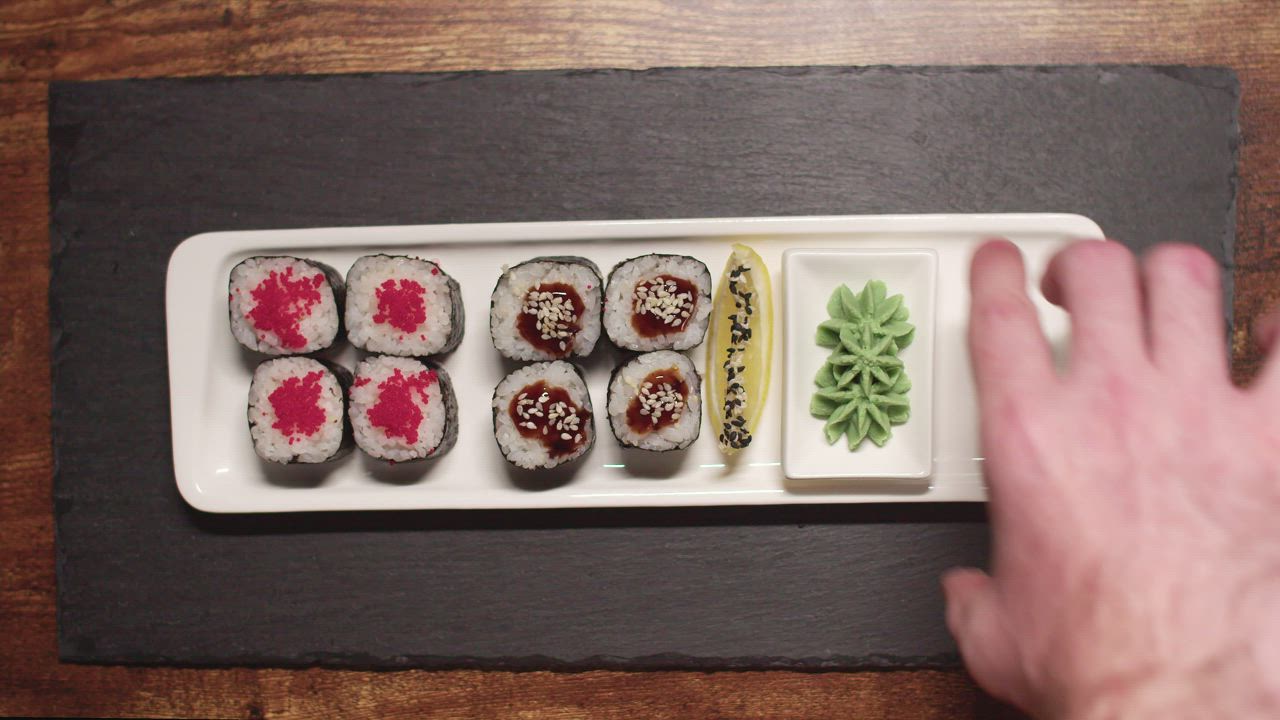 Chef plating sushi with ginger and wasabi - Free Stock Video